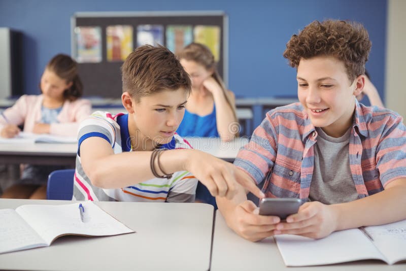 Student Using Mobile Phone in Classroom Stock Photo - Image of girl ...