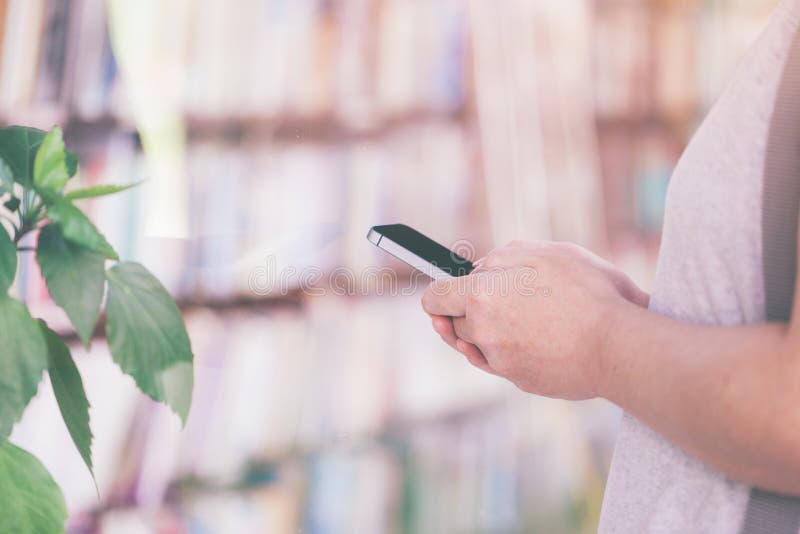 Student Using Mobile Phone in Front of the Library Stock Photo - Image ...