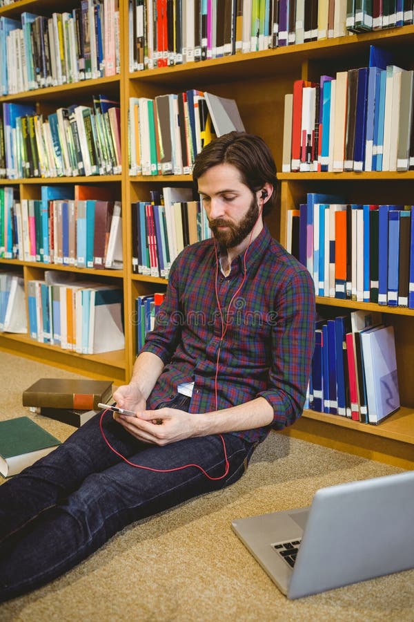 Student Using Phone in Library on Floor Stock Image - Image of college ...