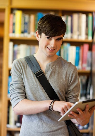 A Student Using a Tablet Computer Stock Image - Image of sitting ...