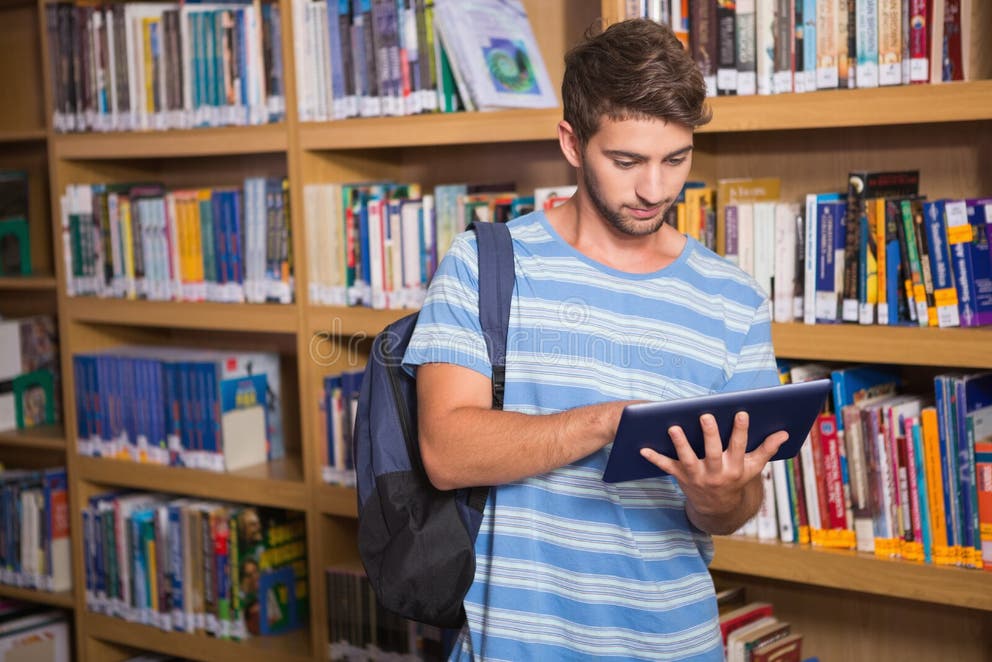 Student Using Tablet in Library Stock Photo - Image of library, indoors ...