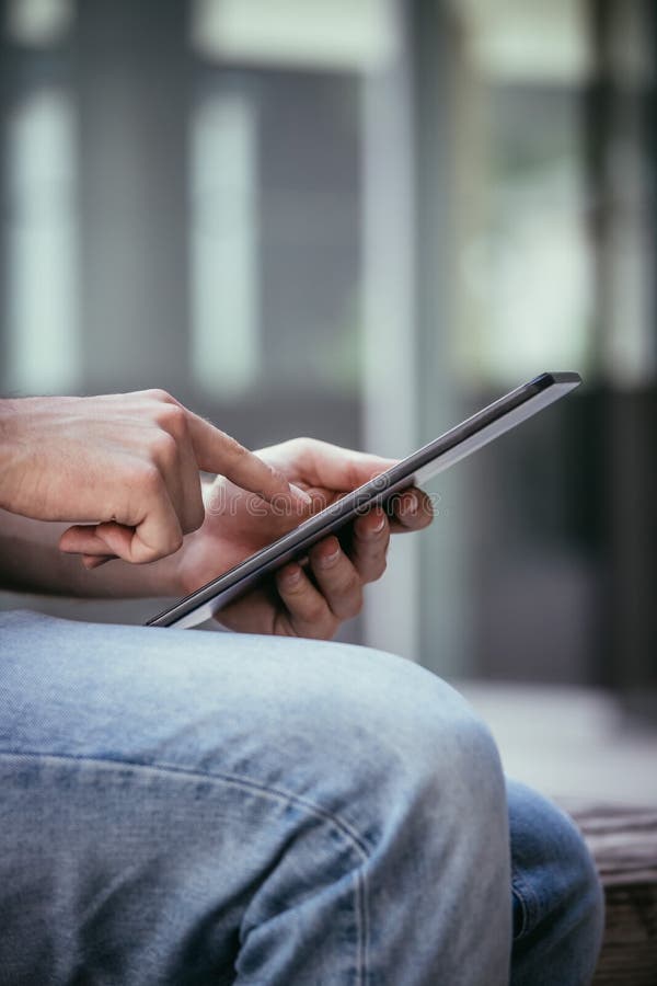 Student Using a Tablet Pc on the Campus. Outdoors, Urban Feeling, Close ...