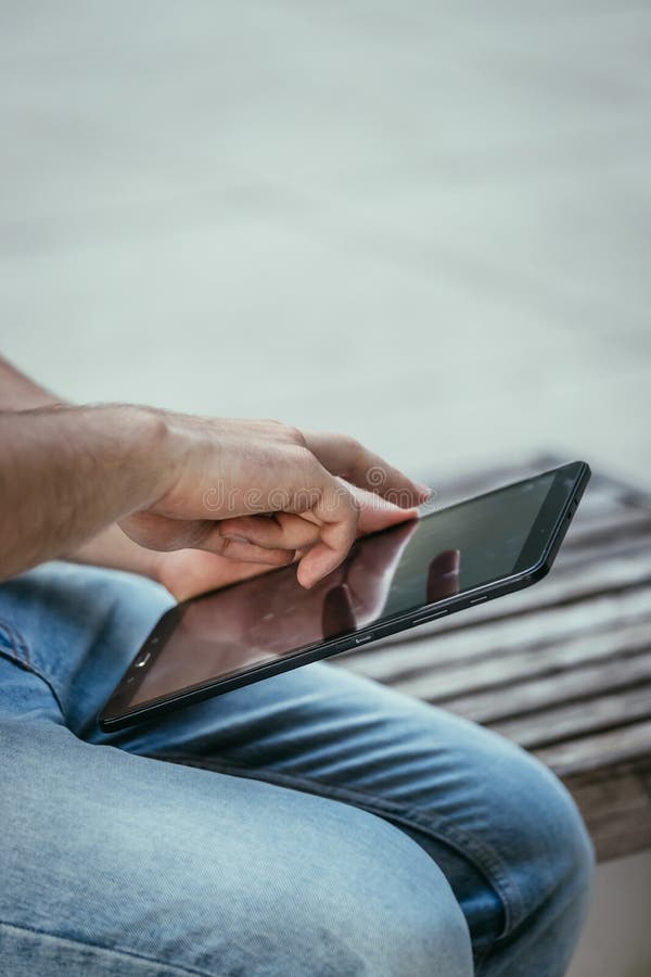 Student Using a Tablet Pc on the Campus. Outdoors, Urban Feeling, Close ...