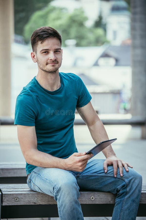 Student Using a Tablet Pc on the Campus. Outdoors, Urban Feeling ...