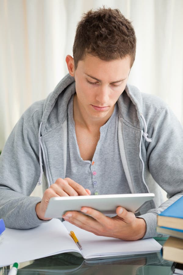Student using a touch pad stock image. Image of adult - 25334793