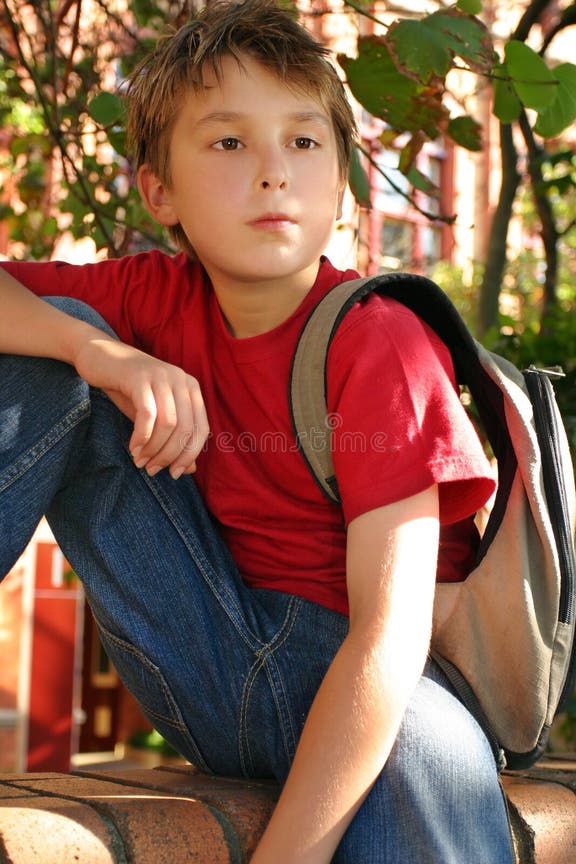 Student Waiting Outside School Stock Image - Image of jeans, scholastic ...