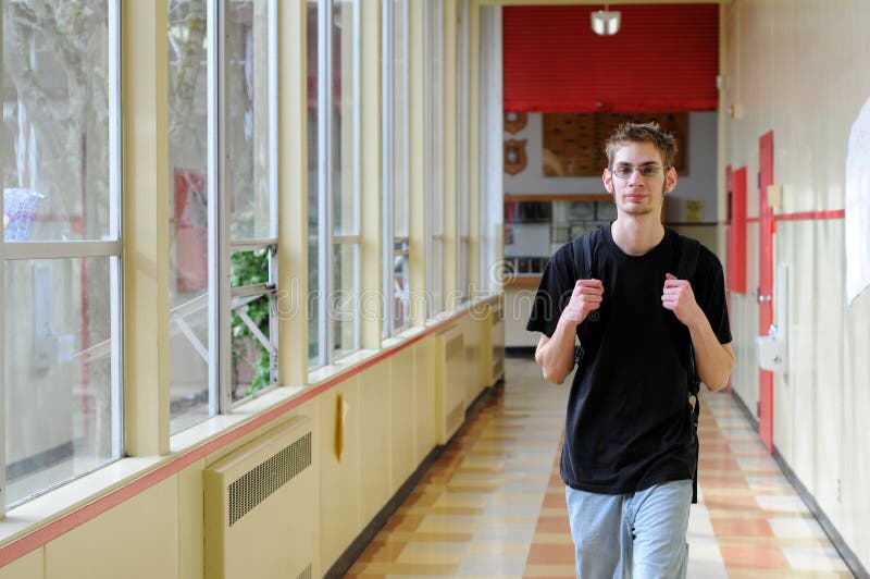 Student Walking In Hallway Royalty Free Stock Photo - Image: 13898165
