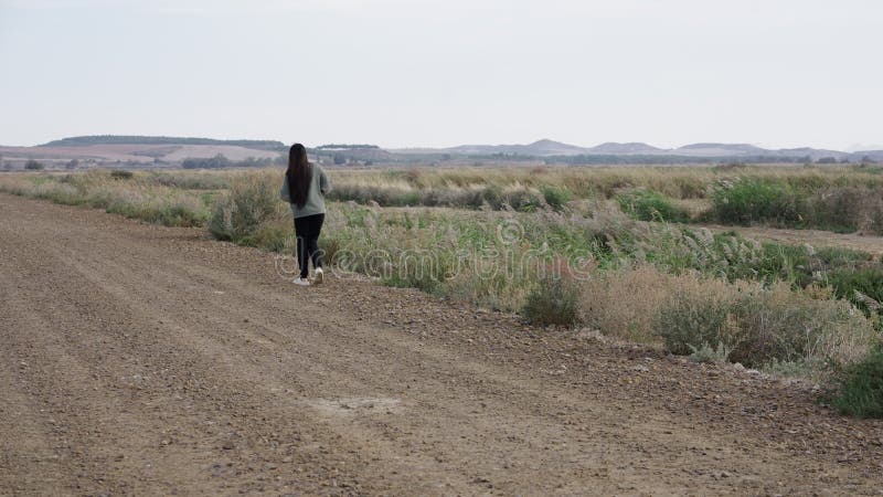 Student Walking Lost in the Desert with Mountains in the Background ...