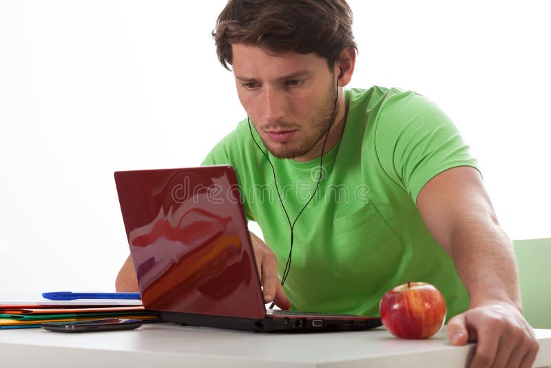 Student Guy Watching Video Lecture Online on Laptop Sitting Indoors ...