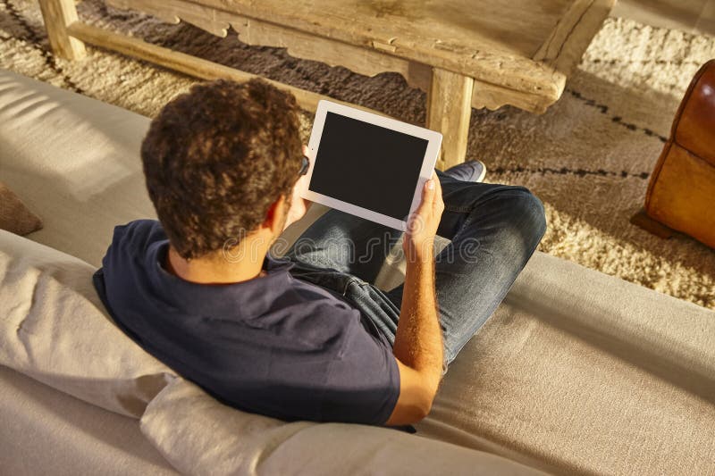 Student Watching a Tablet on a Couch. Social Media Network Stock Image ...