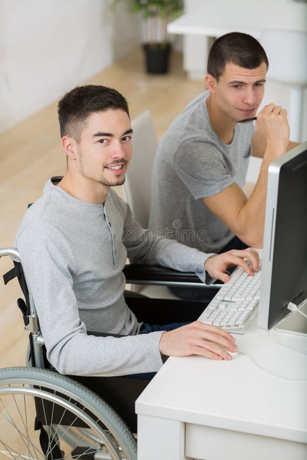 Student in Wheelchair Typing on Computer Stock Photo - Image of ...