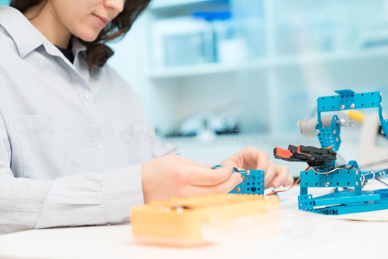 Student Woman in Robotics Laboratory Working on Project Mechatronics ...