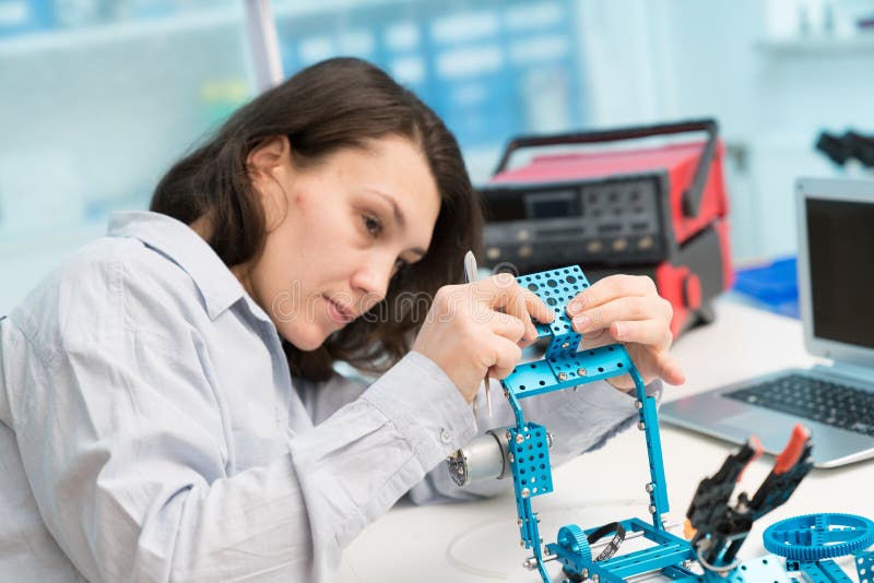 Student Woman in Robotics Laboratory Working on Project Mechatronics ...