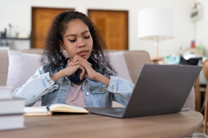 Student Woman in Thinking Writing Notes in Notebook Watching Webinar ...