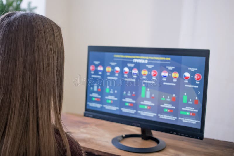 A Student Working at Home Using the Computer, Watching the Screen ...