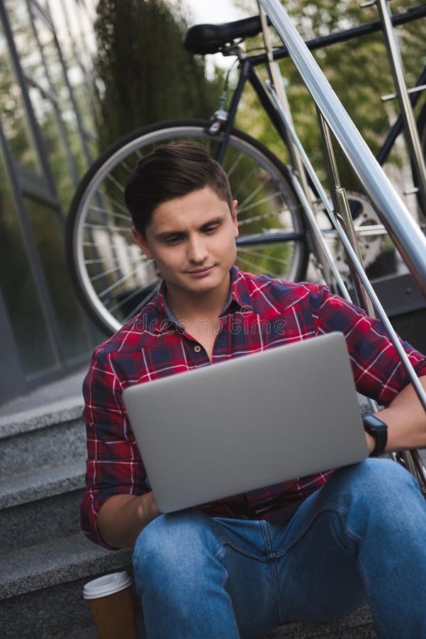 Student Working on Laptop while Sitting on Stairs at the Street Stock ...