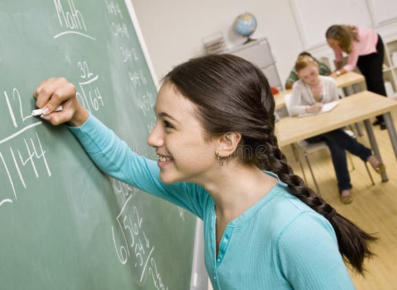 Student Writing on Blackboard Stock Image - Image of confident, child ...