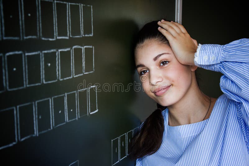 Upset Student Stay Near Blackboard in Classroom Stock Photo - Image of ...