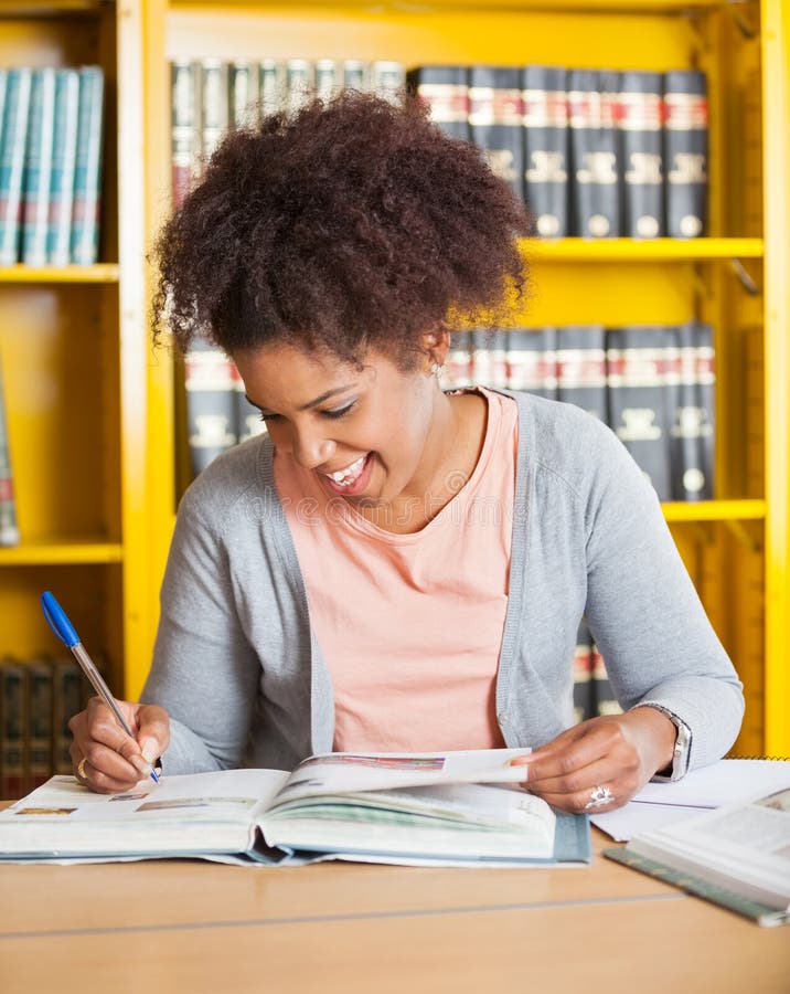 Student Writing Exam at Desk in Classroom Stock Image - Image of ...