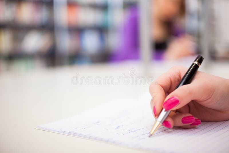 Student Writing on a Copybook Stock Photo - Image of class, library ...