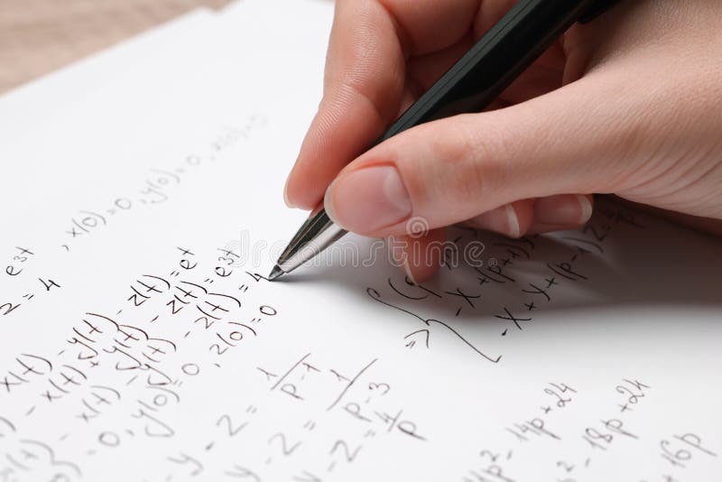 Student Writing Different Mathematical Formulas on Paper, Closeup Stock ...