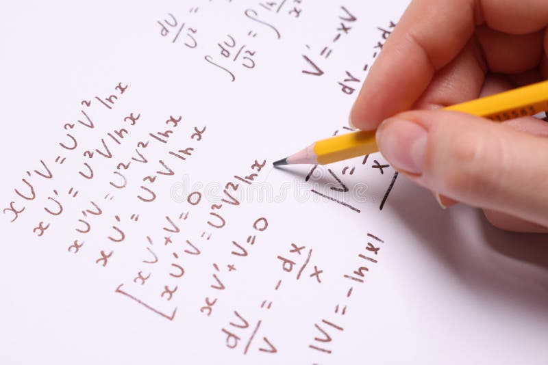 Student Writing Different Mathematical Formulas on Paper, Closeup Stock ...