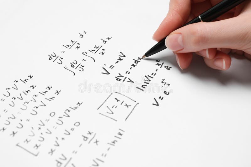 Student Writing Different Mathematical Formulas on Paper, Closeup Stock ...