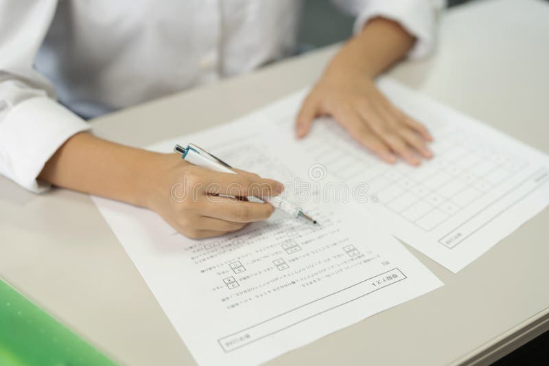 Student Writing on Exam Paper Stock Image - Image of high, asian: 365488373