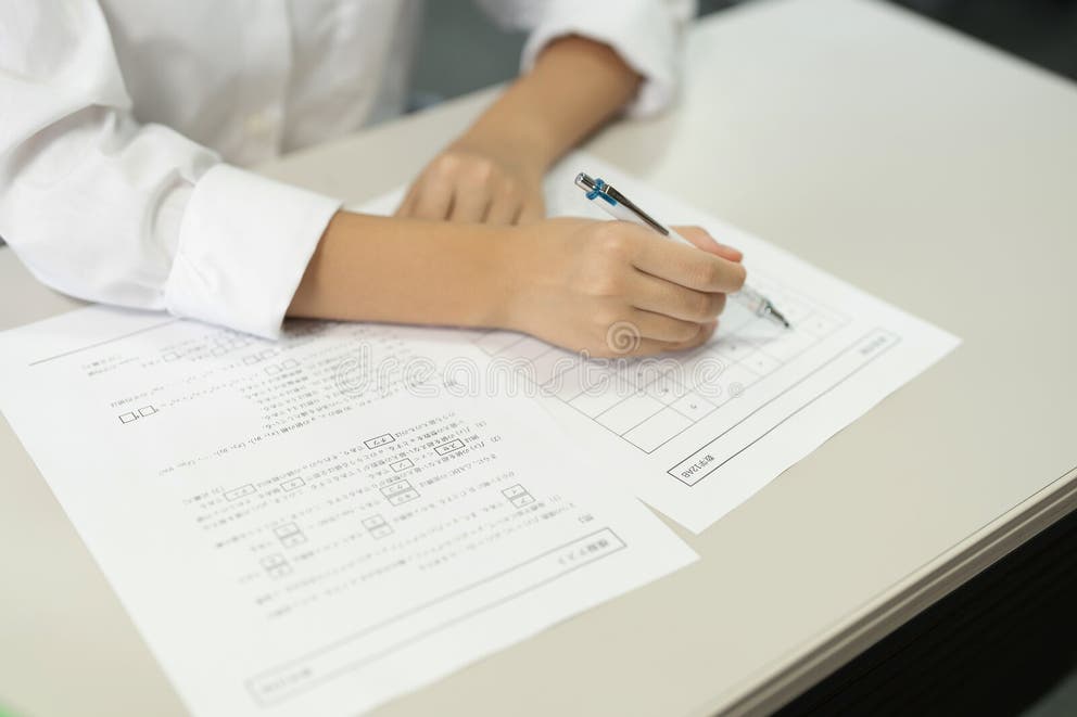 Student Writing on Exam Paper Stock Image - Image of lesson, paper ...