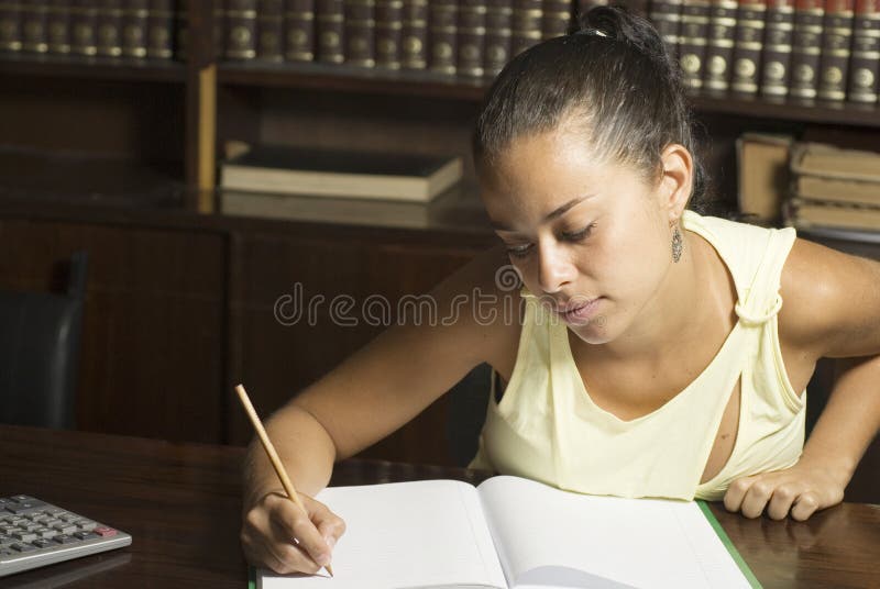 Student Writing - Horizontal Stock Photo - Image of seated, books: 6213524