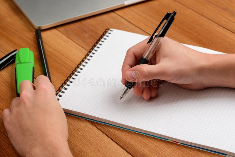 Student Writing in the Notepad. Making Notes and Studying Stock Image ...