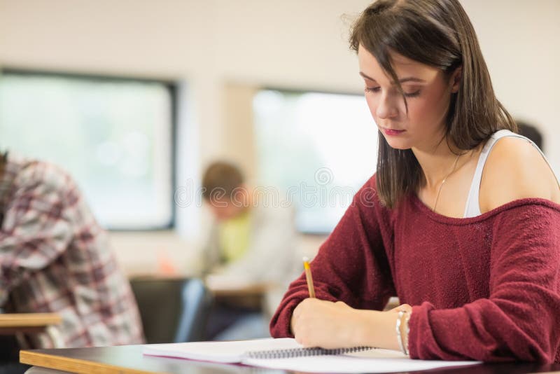 Student Writing Notes in the Classroom Stock Photo - Image of women ...