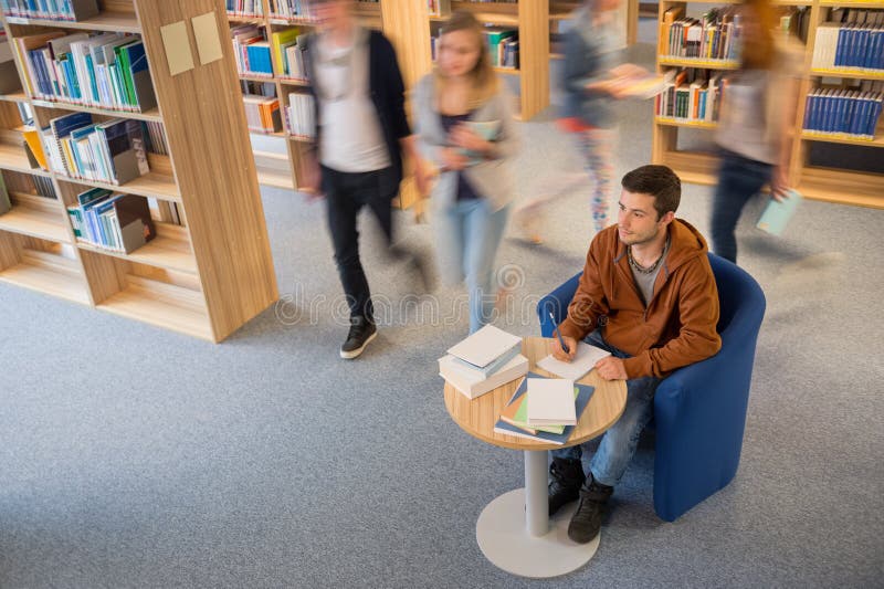 Student Writing Notes in Library Blur Motion Stock Photo - Image of ...
