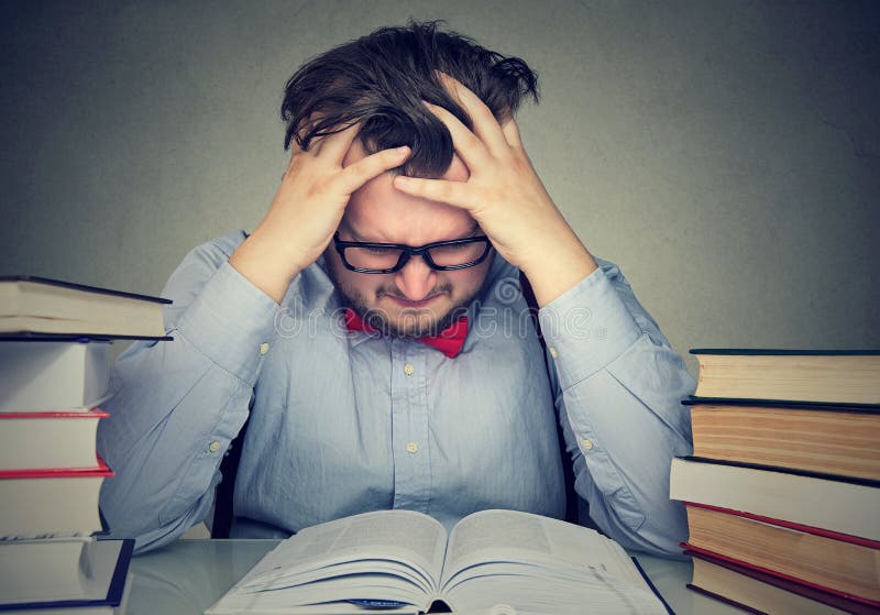 Student Young Man with Desperate Expression Looking at Books Stock ...