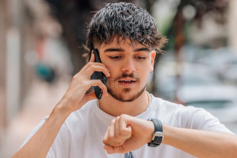 Student or Young Man in the Street Talking on the Mobile Phone and ...