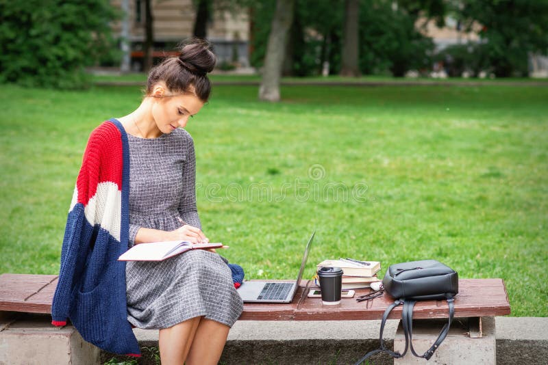Student Young Woman is Writing Notes Stock Image - Image of bench ...