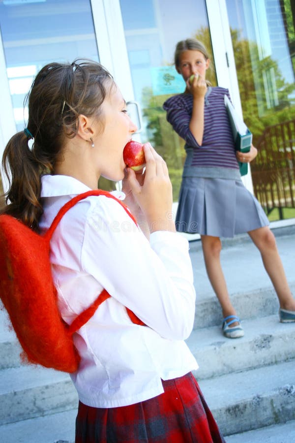 Students with apple stock image. Image of apple, attractive - 6400041
