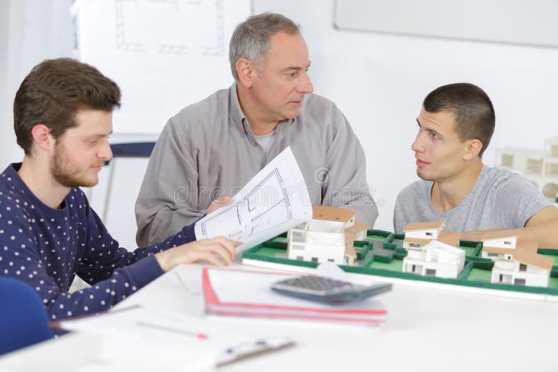 Architecture Students Working On Architectural Model In University ...