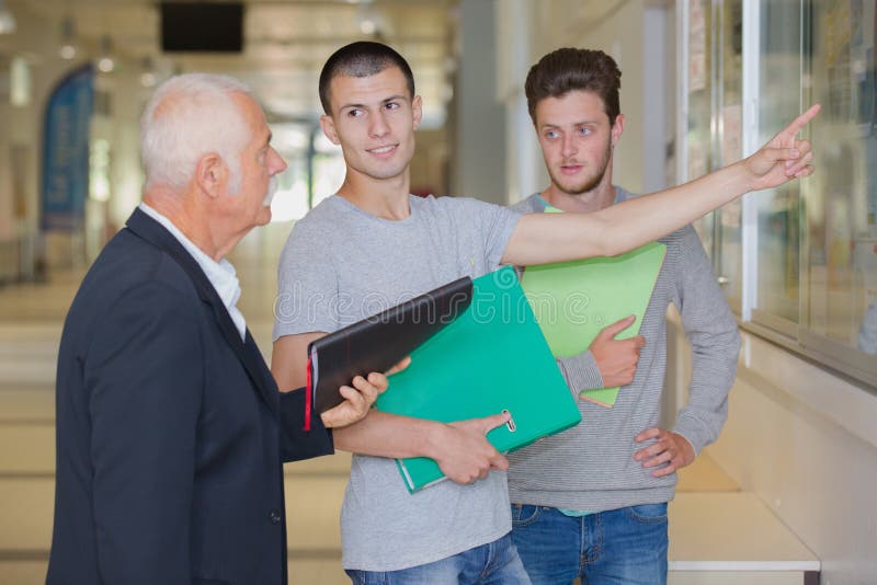 Students Asking Each Other about Their Hometasks. Stock Photo - Image ...