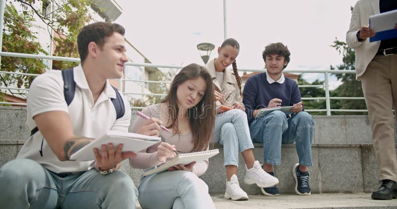 Students Collaborate with Professor after Class for Extra Help on Tasks ...