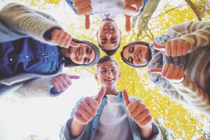 Students in autumn park stock photo. Image of friendship - 237570600
