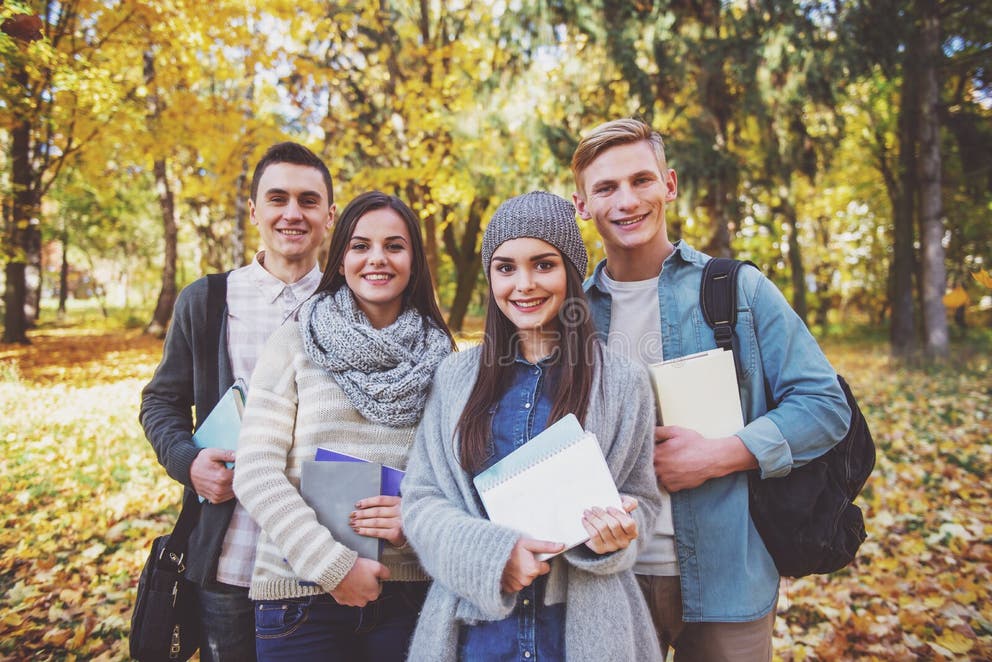 Students in autumn park stock image. Image of season - 237570617