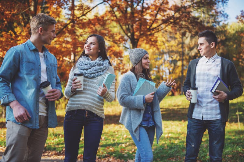 Students in autumn park stock image. Image of lifestyle - 237570761
