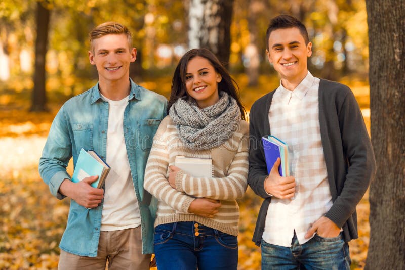 Students in autumn park stock photo. Image of lifestyle - 64433970