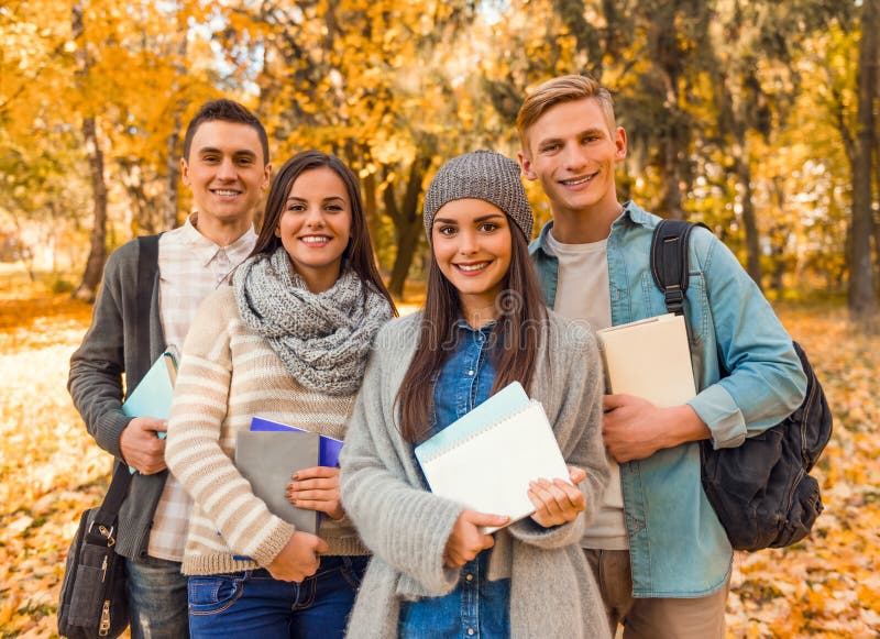 Students in autumn park stock photo. Image of fall, pretty - 64434092