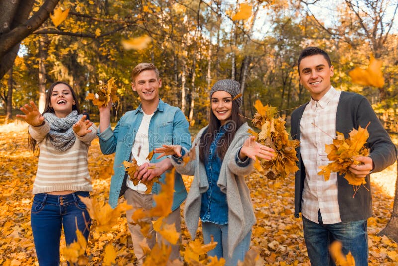 Students in autumn park stock photo. Image of autumn - 64434262