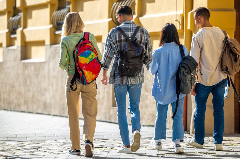 Students with Backpacks Walking at University Campus Together. Stock ...