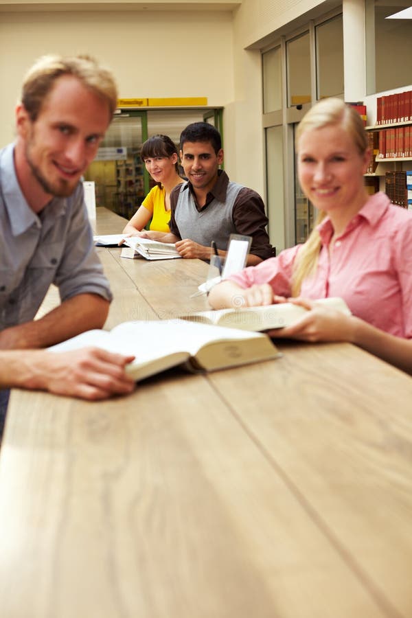 Students with books stock image. Image of hall, people - 11823451