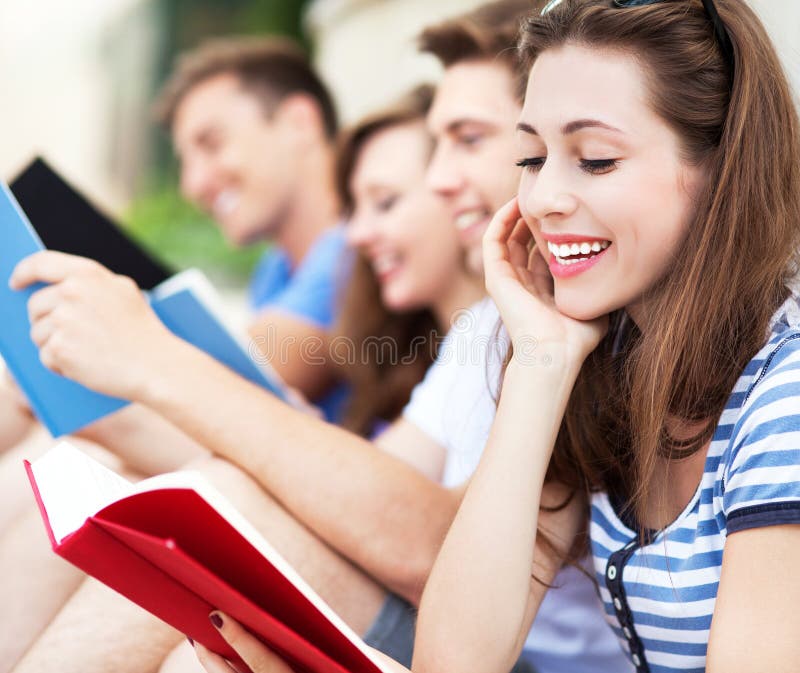 Students holding books stock image. Image of friends - 21237819