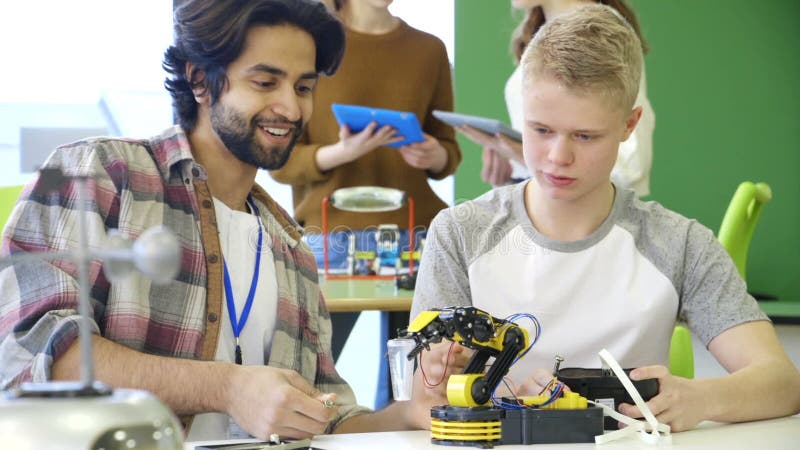 Students Building a Robotic Arm Stock Footage - Video of interior, boys ...